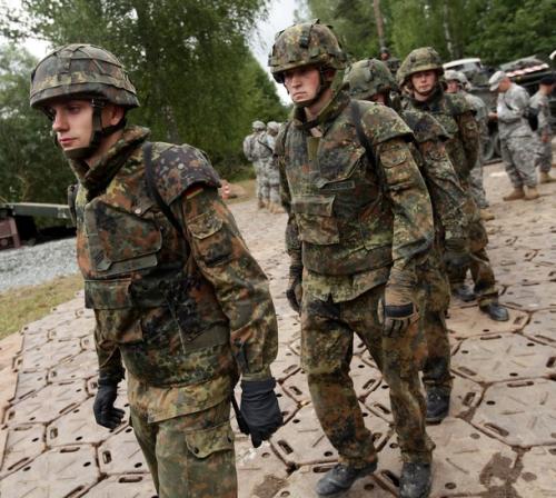 German army's crisis role widened to using weapons on the streets